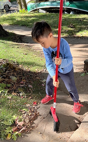 Six-year-old Jacob is cleaning up the Beach with his porch-sweeping ...